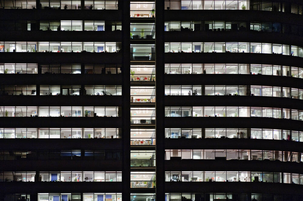 Building lit up at night - Photographic print for sale