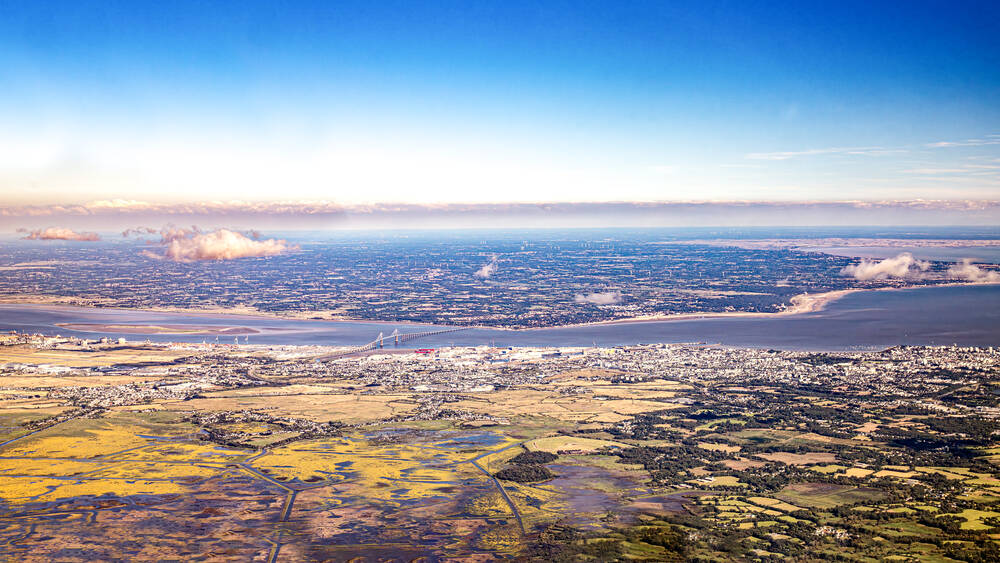 Loire estuary and Saint Nazaire bridge from the Brière marshes seen ...